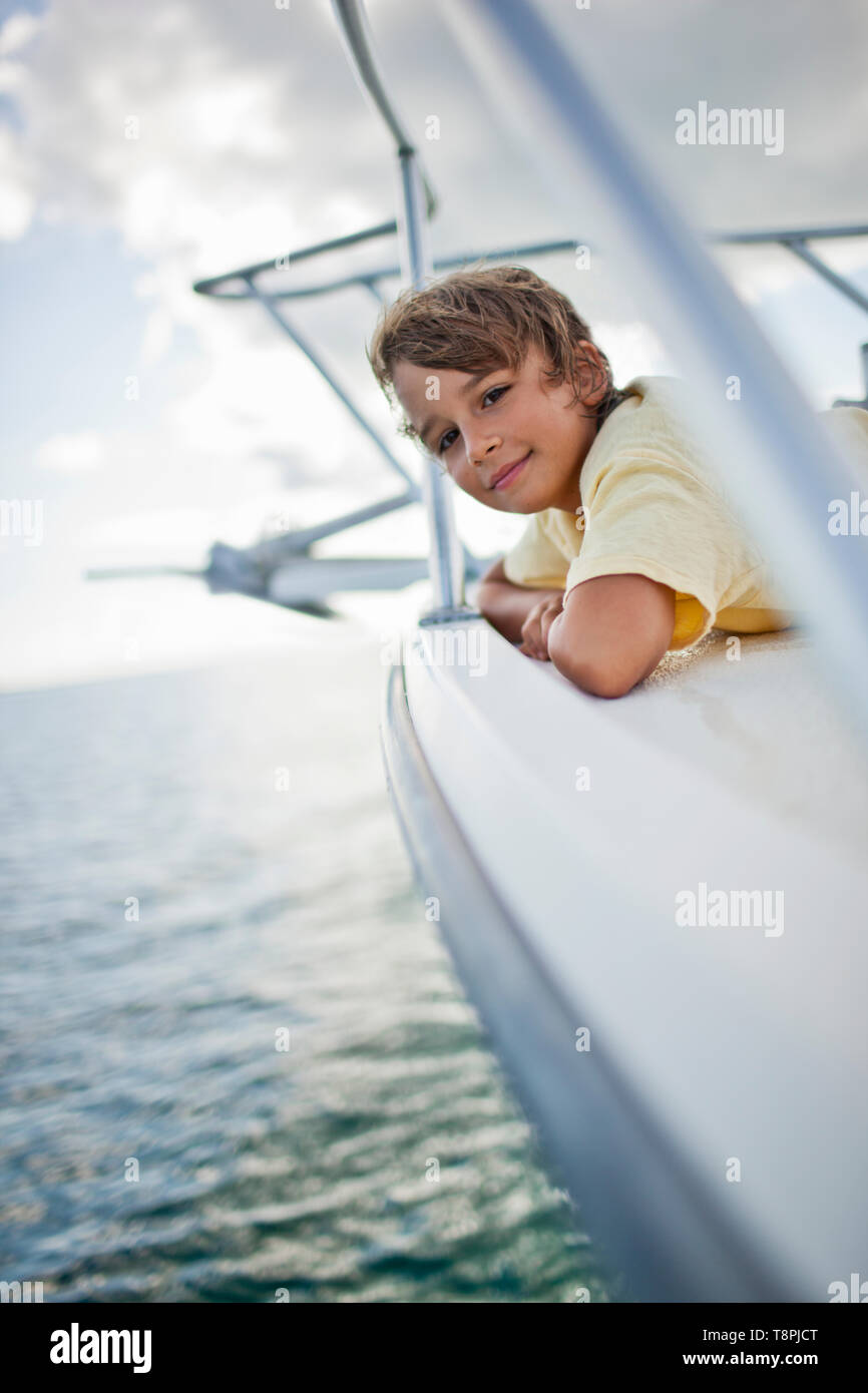 Portrait of a happy young boy on a boat Stock Photo - Alamy