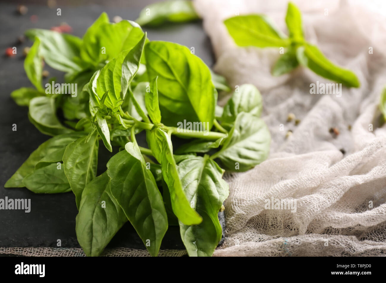 Fresh green basil on slate plate, closeup Stock Photo - Alamy