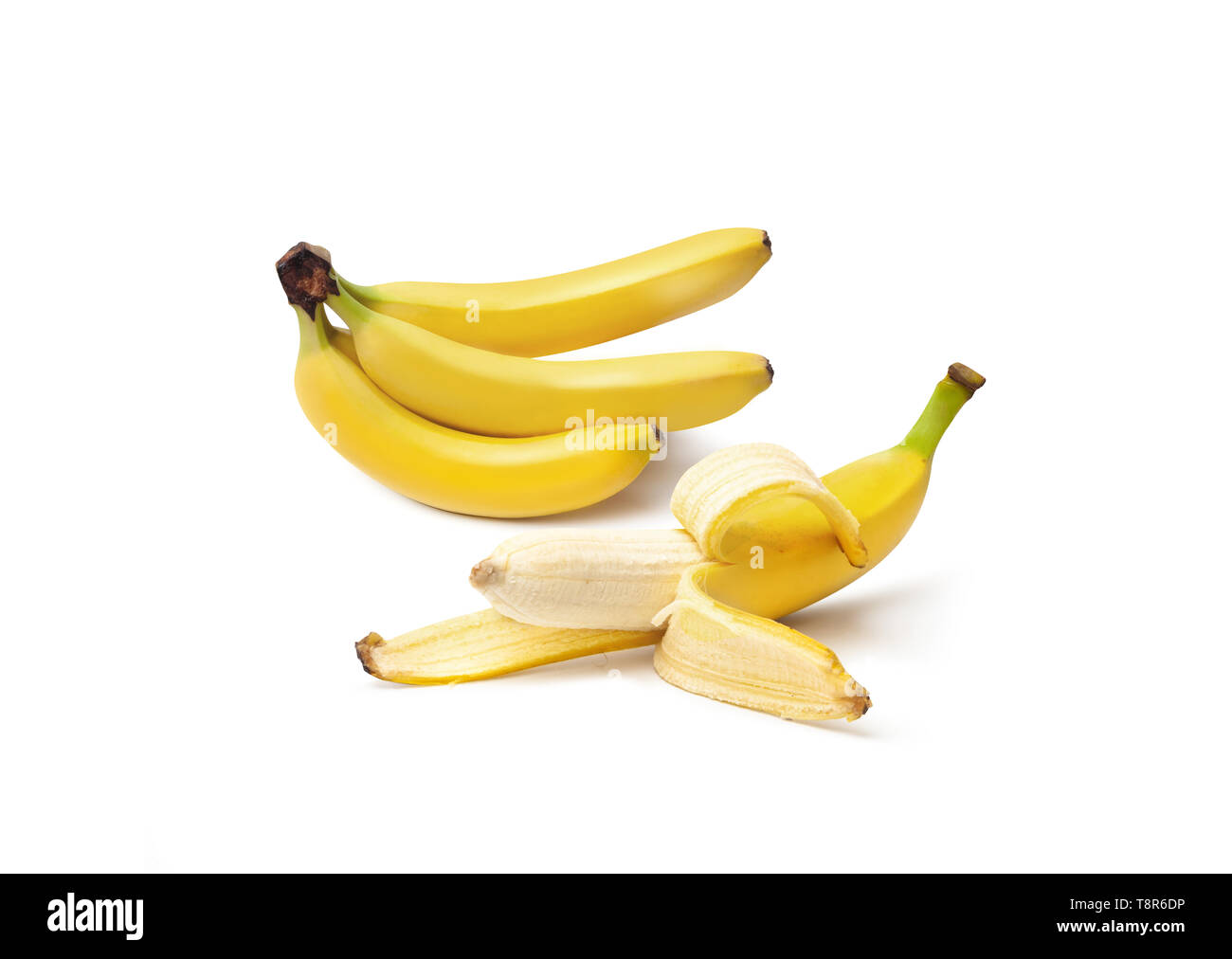 Bunch of bananas and Half peeled banana isolated on white background ...