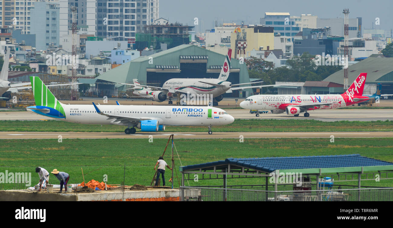 Saigon, Vietnam - May 11, 2019. Passenger airplanes taxiing on runway ...
