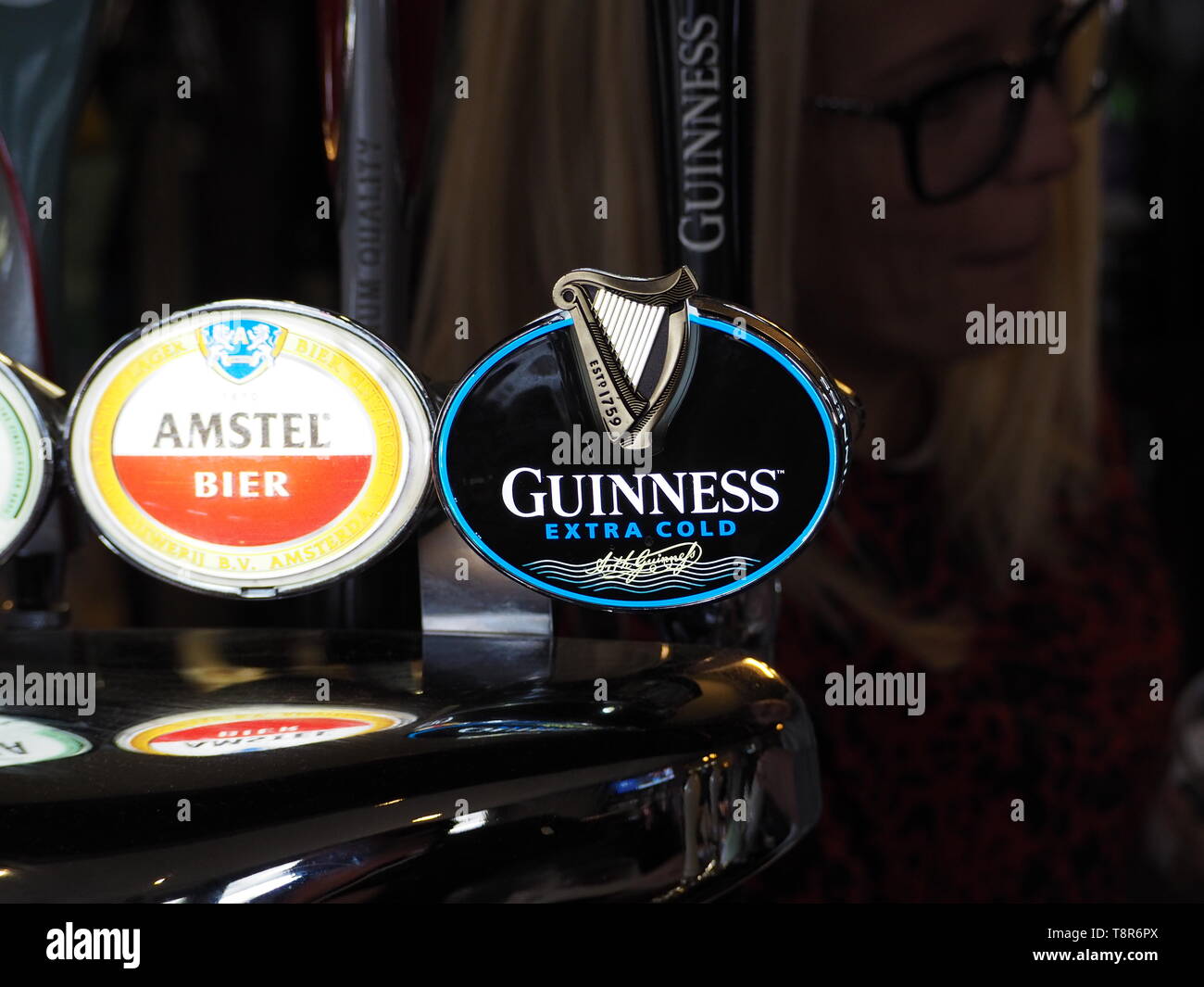Guinness & Amstel tap signs Stock Photo - Alamy