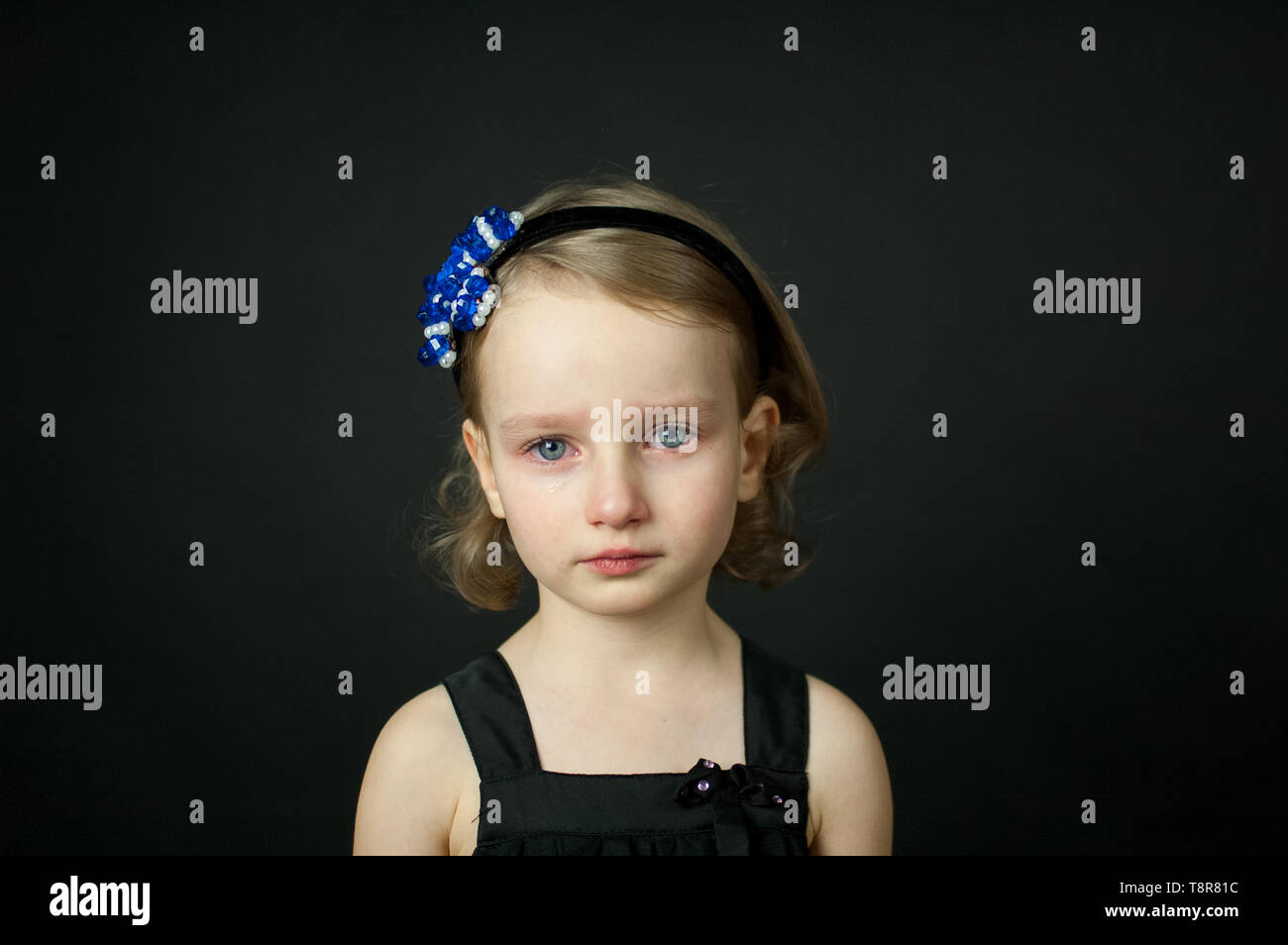 Emotional child with tears - a young girl crying, fine art portrait ...