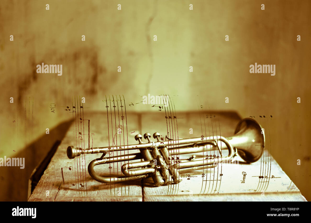 old trumpet on sheet music Stock Photo - Alamy