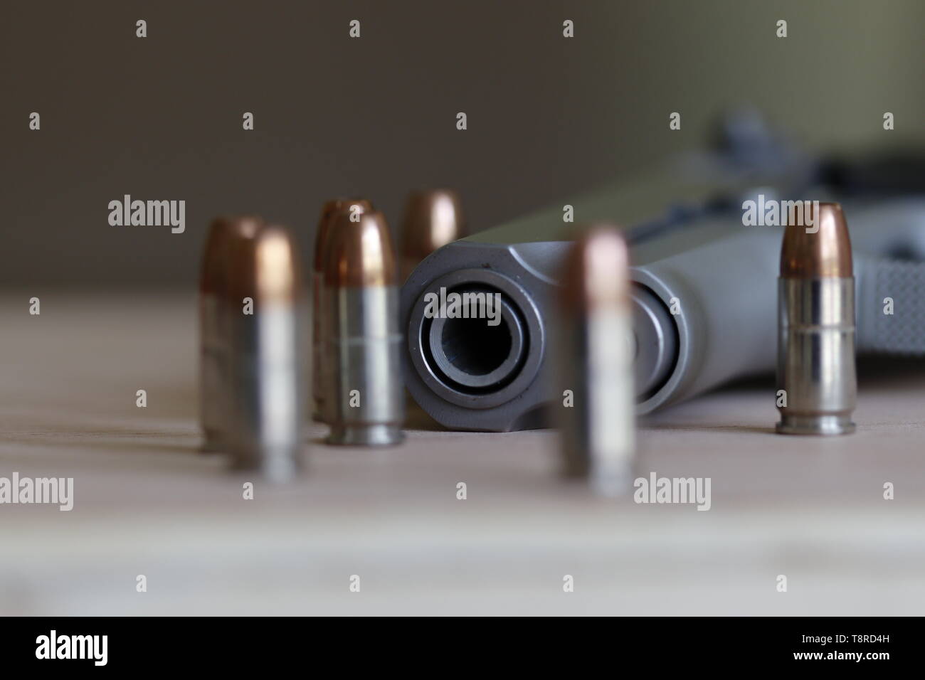 Pistol bullet gun table hi-res stock photography and images - Alamy