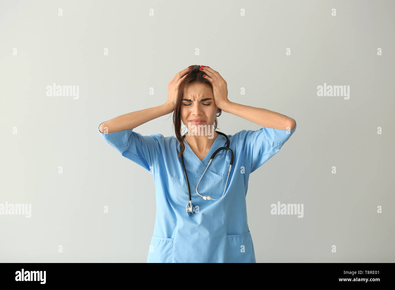 Stressed nurse hi-res stock photography and images - Alamy