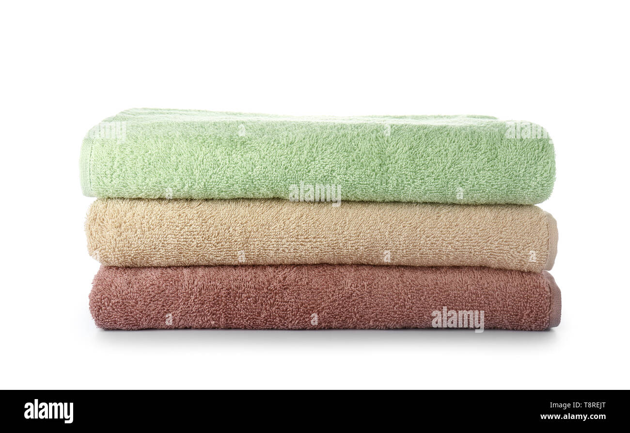 Stack of clean soft towels on white background Stock Photo - Alamy