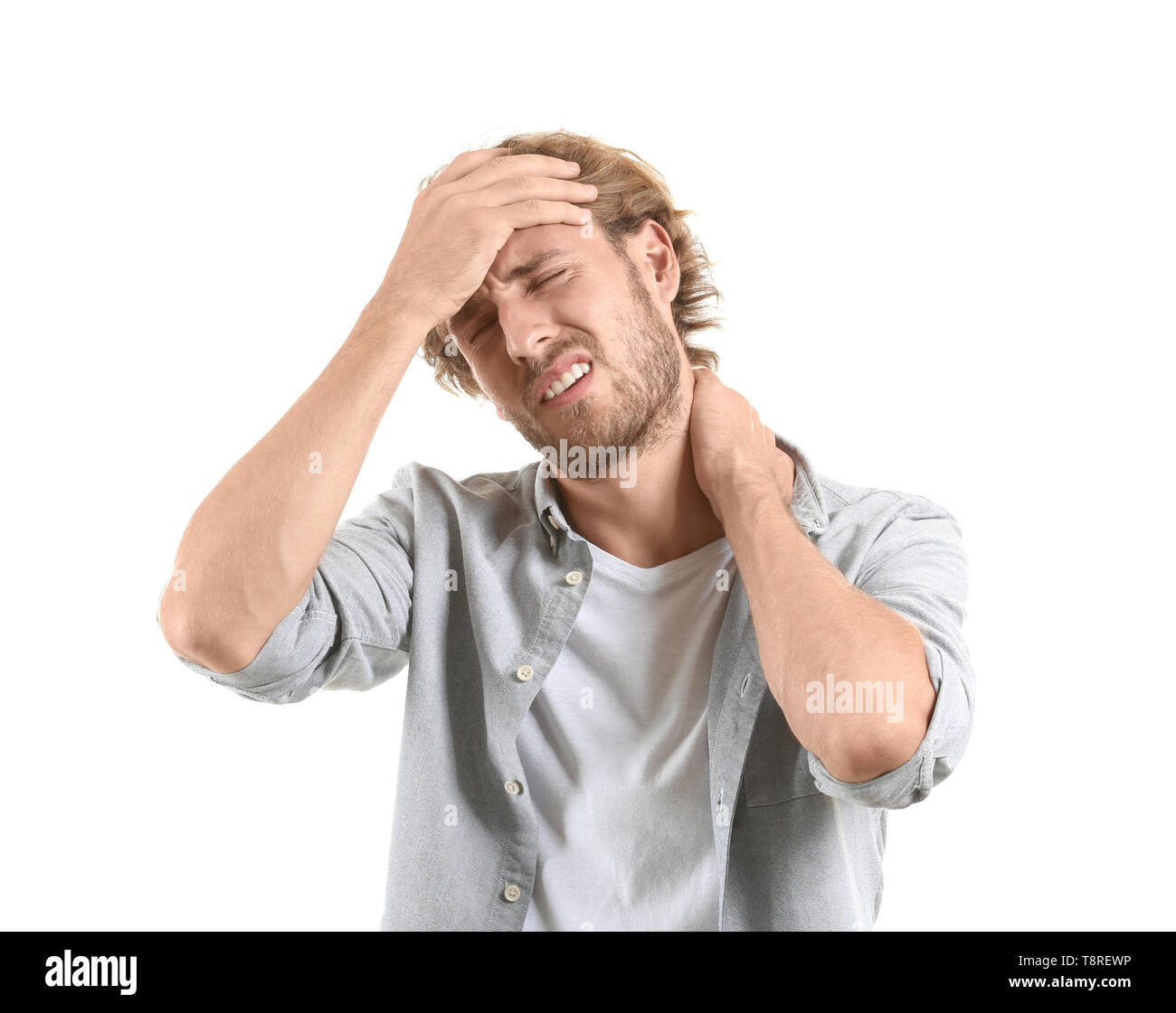 Portrait of man suffering from pain on white background Stock Photo - Alamy