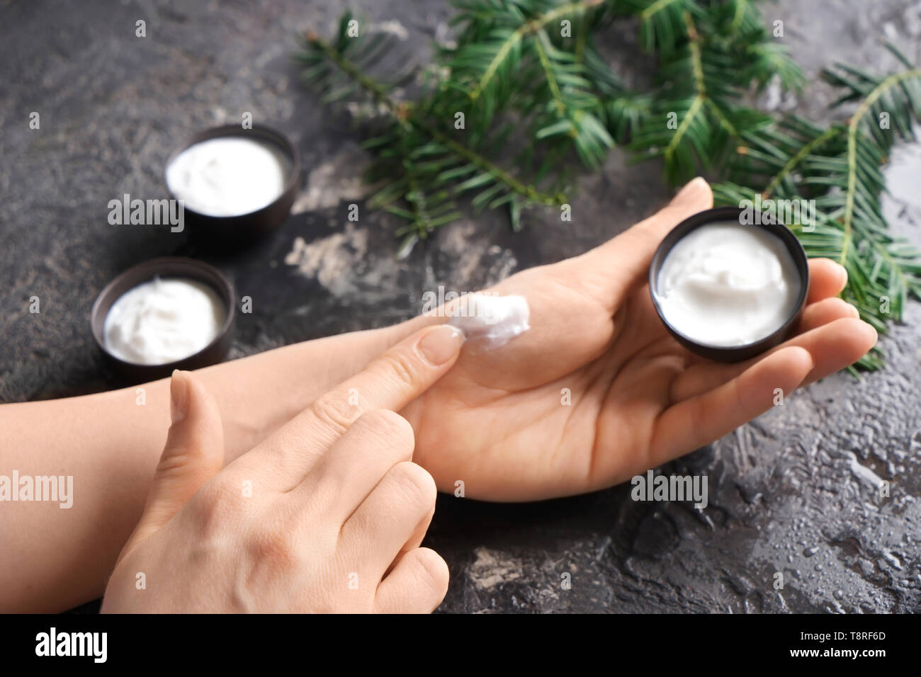 Woman applying body cream, closeup Stock Photo - Alamy
