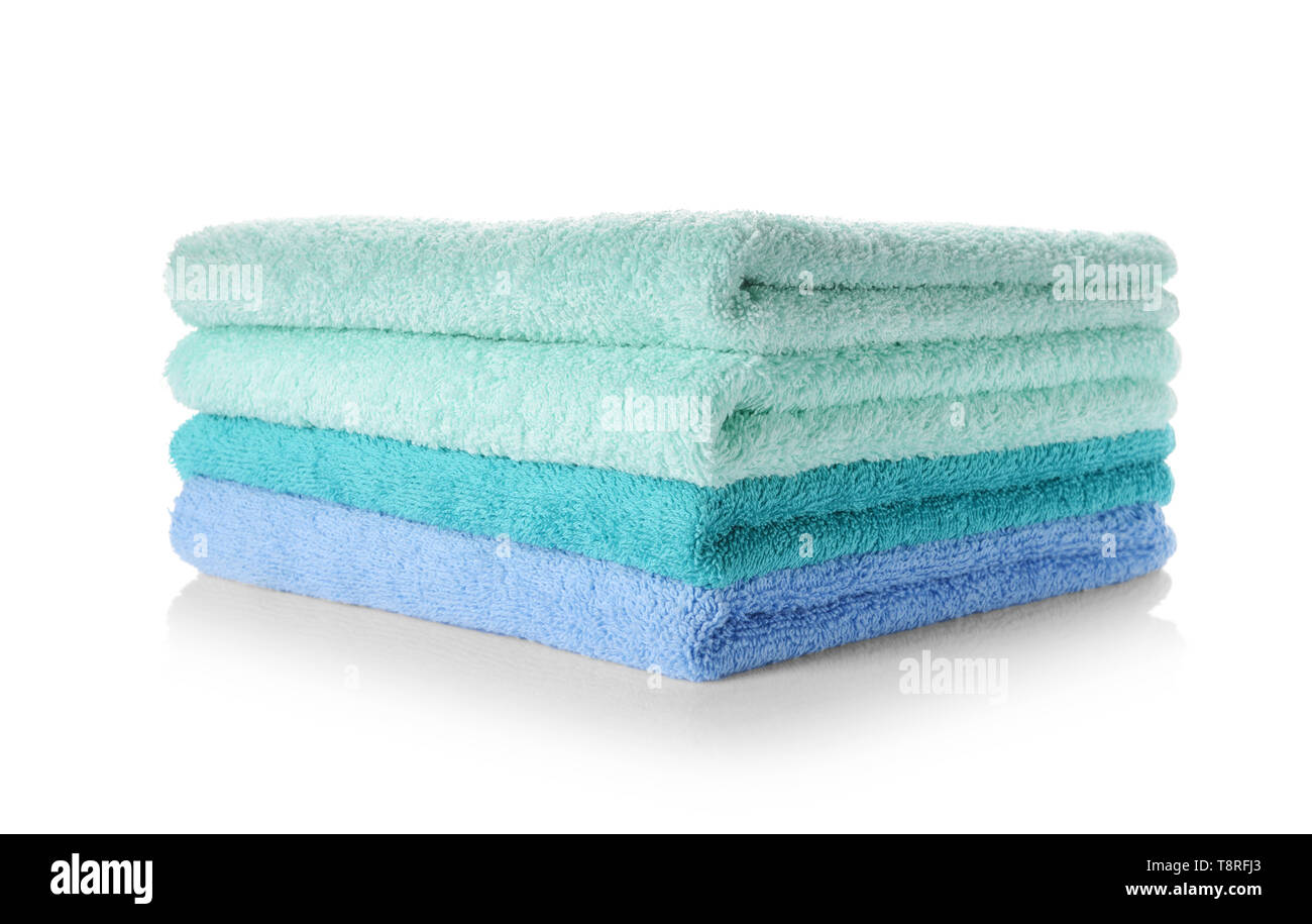Stack of clean soft towels on white background Stock Photo - Alamy