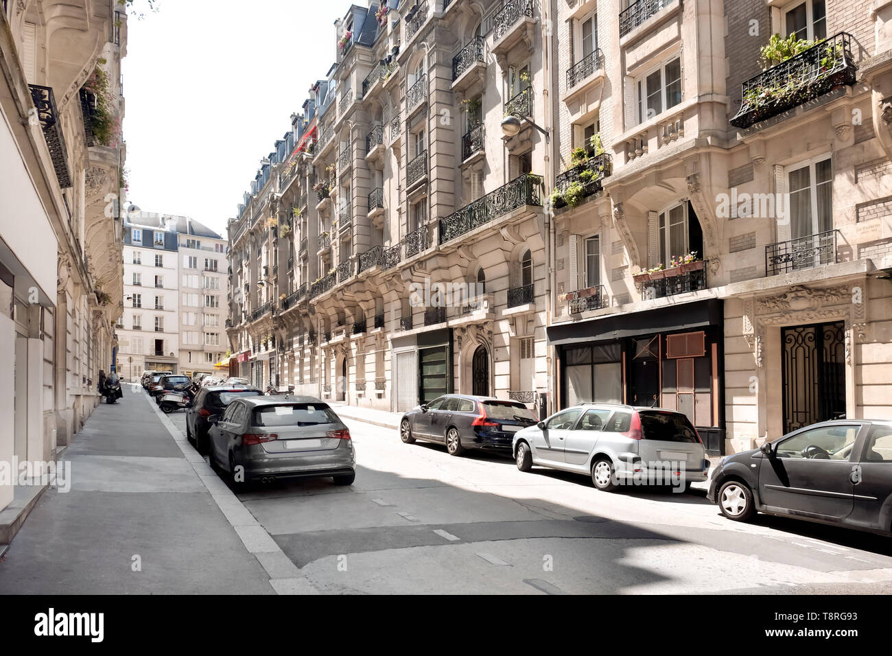 City road with cars and beautiful buildings on sunny day Stock Photo ...