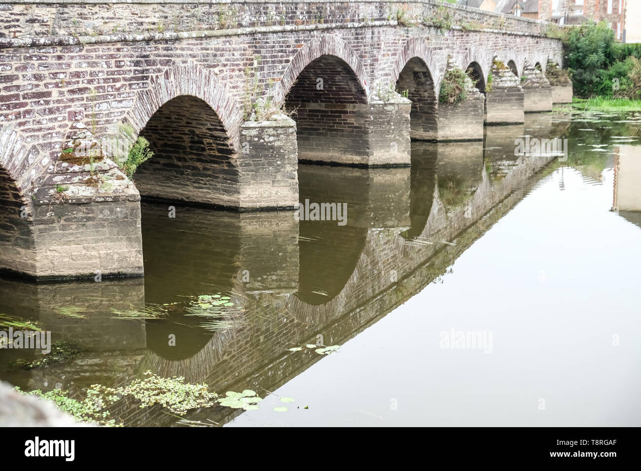 Beautiful stone bridge over river in city Stock Photo - Alamy