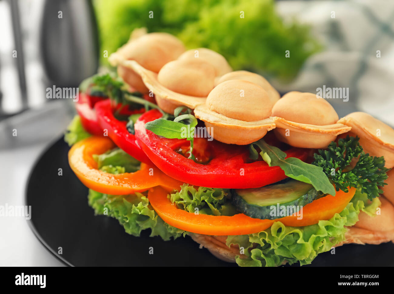 Delicious bubble waffle with vegetables on plate, closeup Stock Photo ...