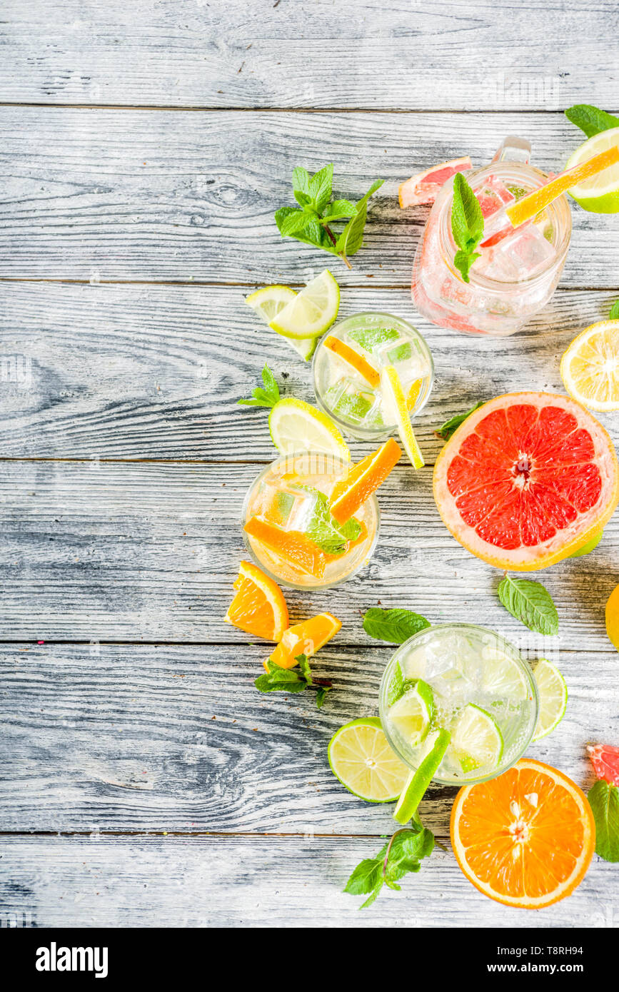 Summer refreshment drinks. Four types of citrus lemonade or mojito ...