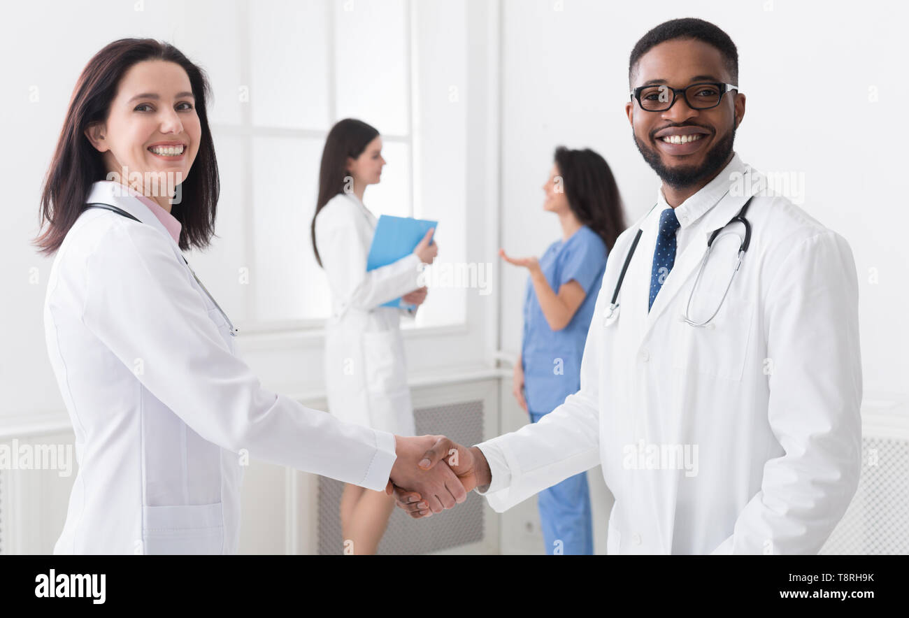 Welcome On Board. Diverse Doctors Shaking Hands Stock Photo - Alamy