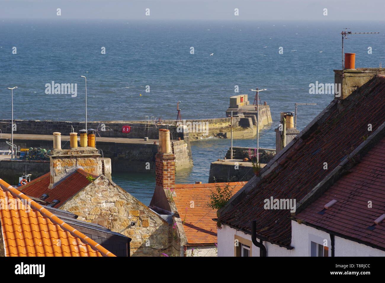 St Monans Harbour Wall from the Rooftops of the village Cottages on a ...