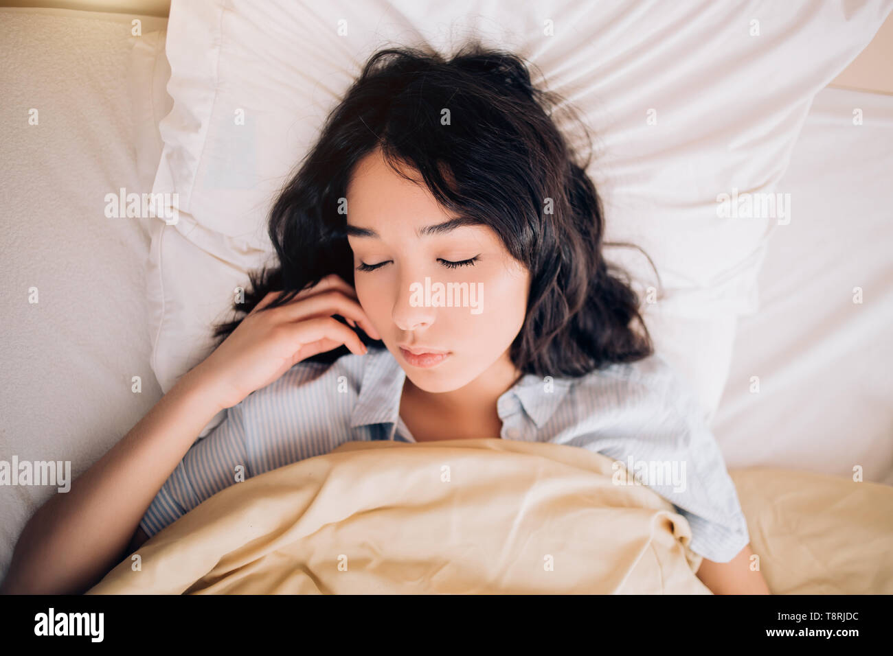 Attractive carefree girl with clean skin sleeping covering blanket in ...