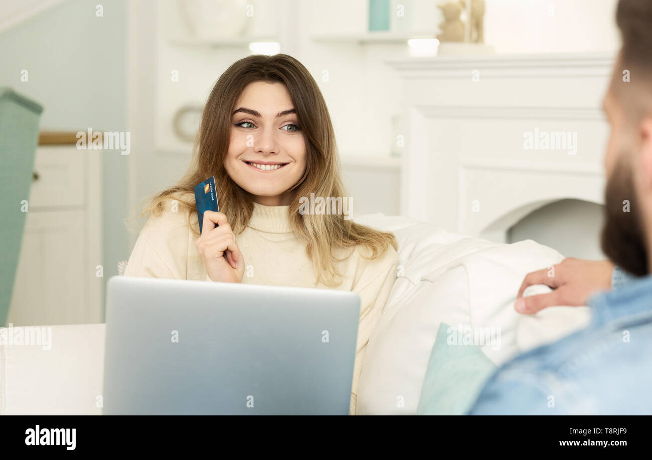 Please, Buy! Woman Asking Husband Order Clothes, Holding Credit Card ...