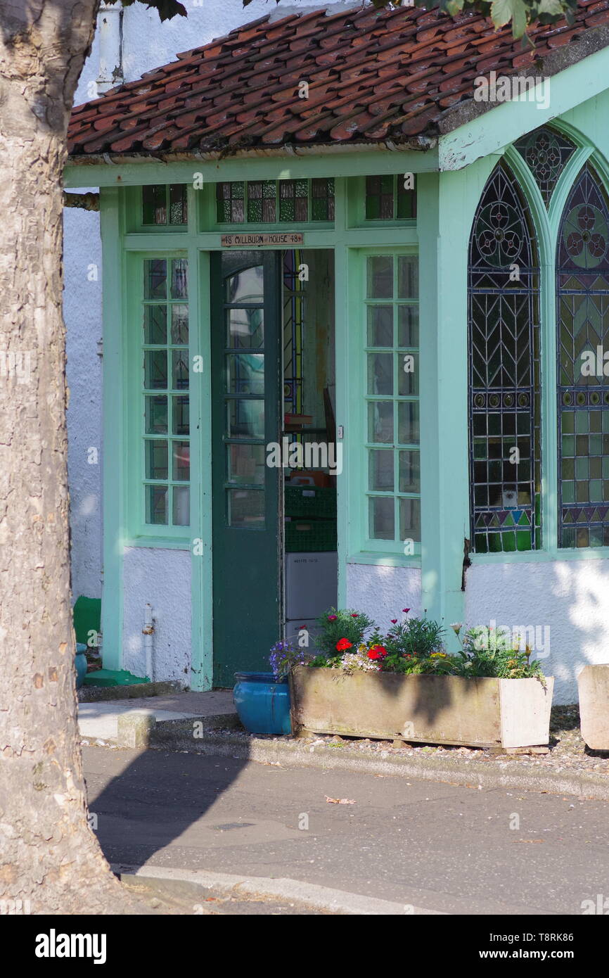 Wooden Green Front Door Porch with Stained Glass Gothic Windows of an ...