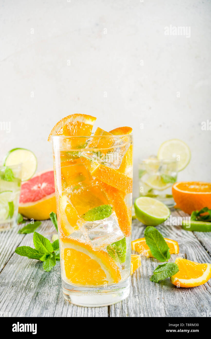 Summer refreshment drinks. Four types of citrus lemonade or mojito ...