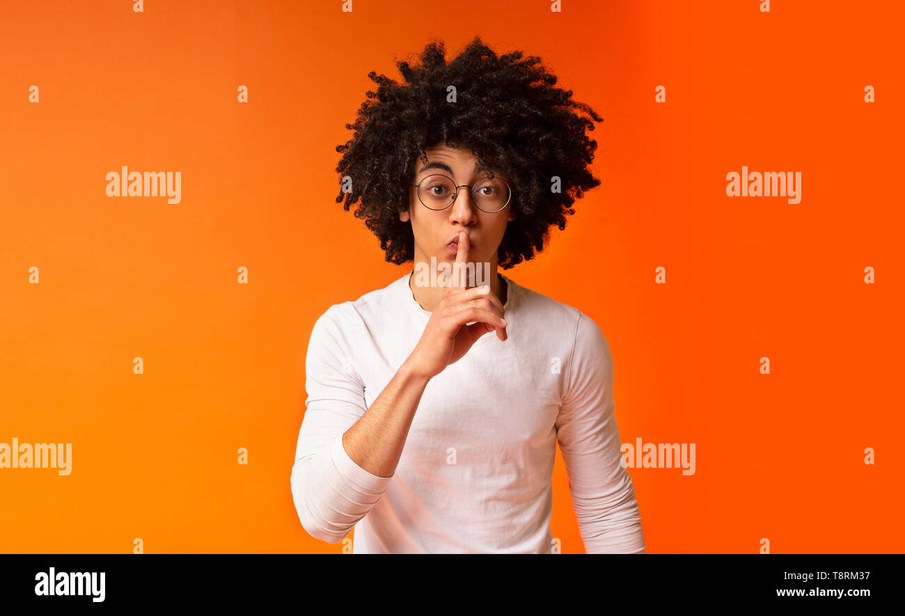 Young african man putting finger hi-res stock photography and images ...