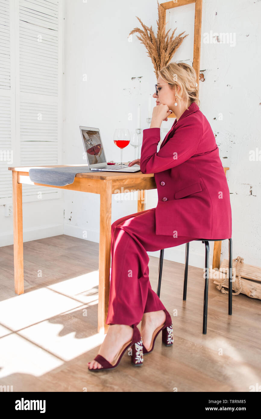 Side view of confident female designer with blonde hair looking ...