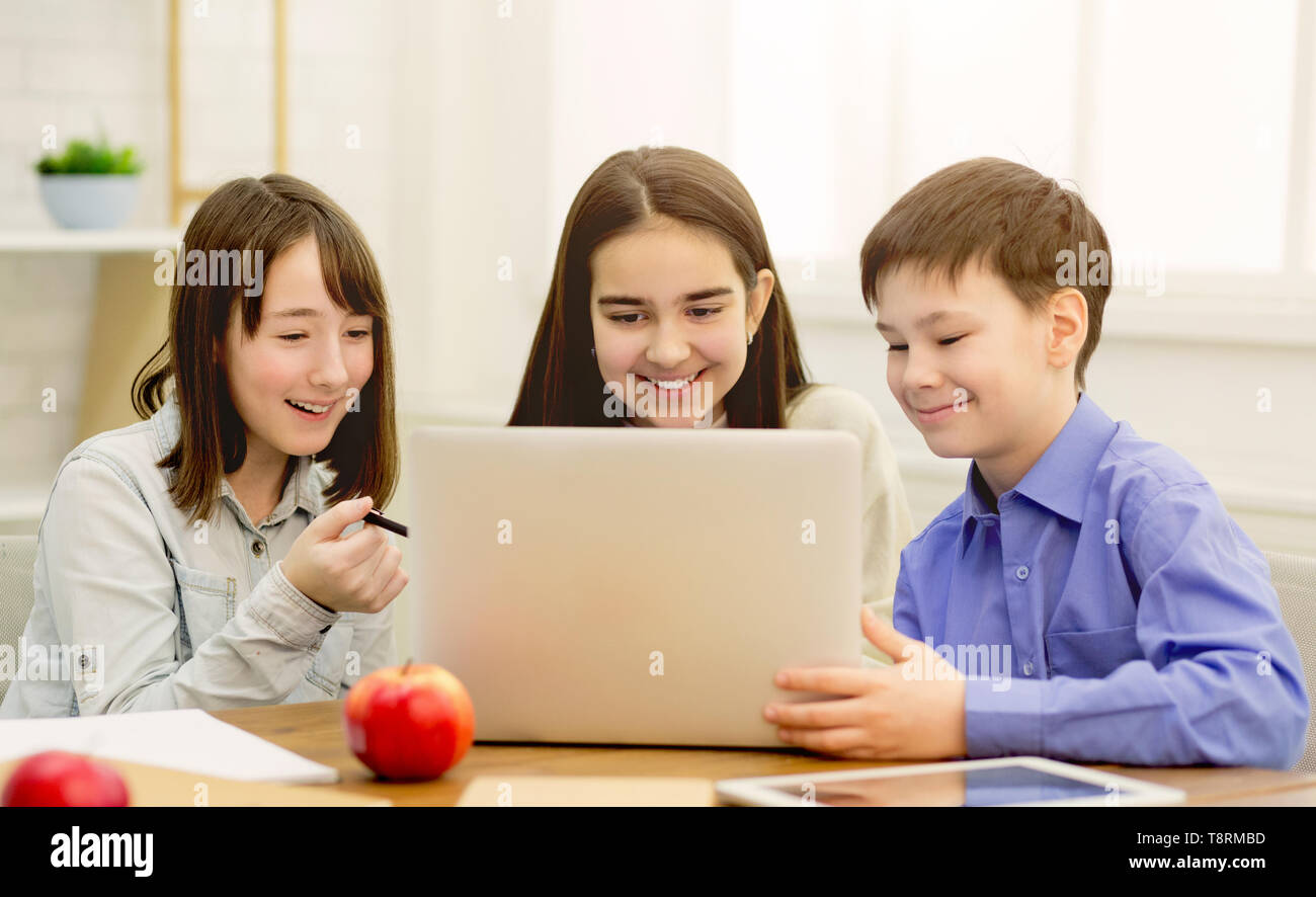Happy Children Surfing Interesting Content On The Internet Stock Photo ...