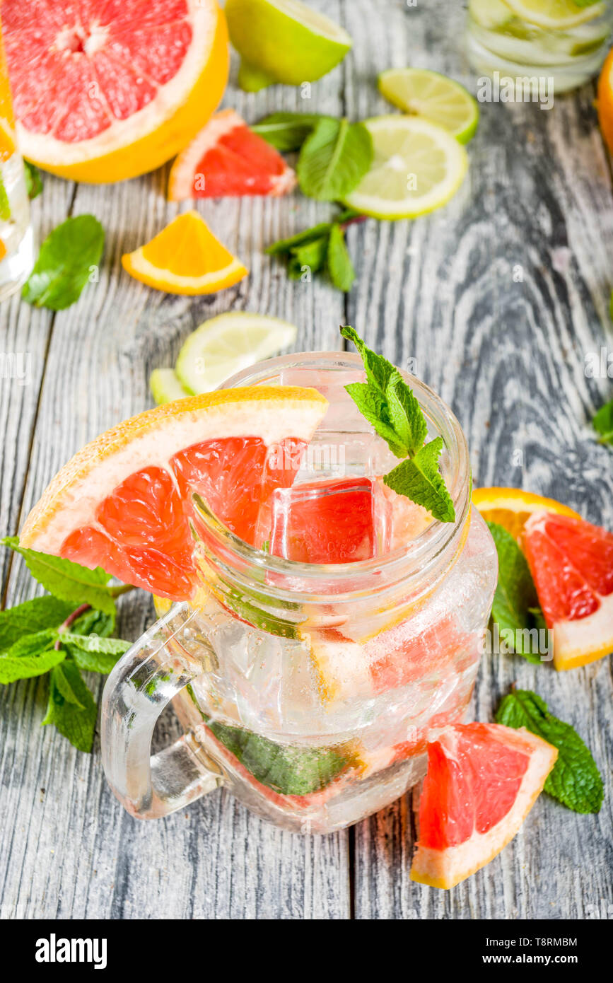 Summer refreshment drinks. Four types of citrus lemonade or mojito ...