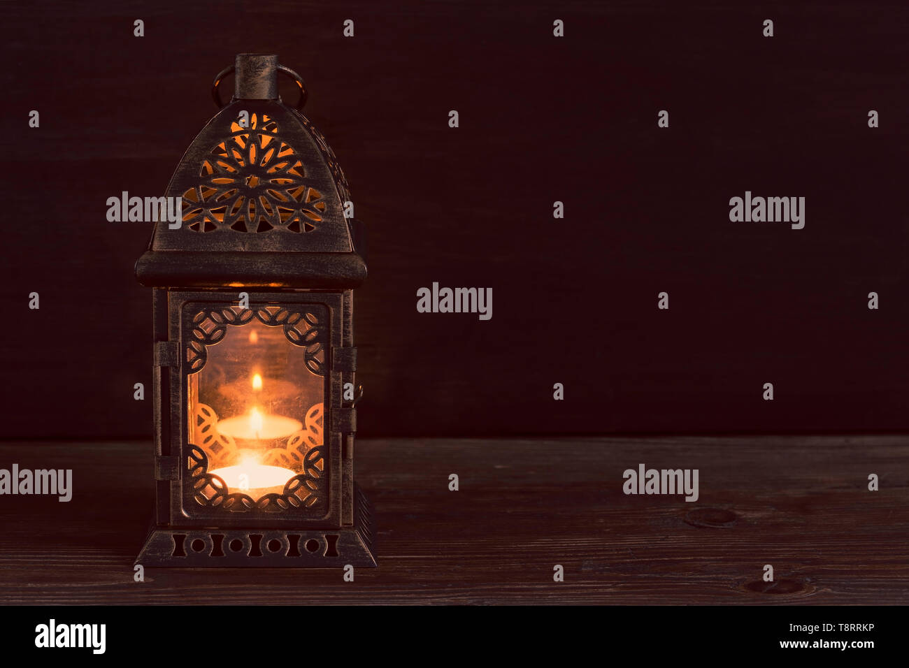 Vintage copper lamp with a burning candle Stock Photo - Alamy