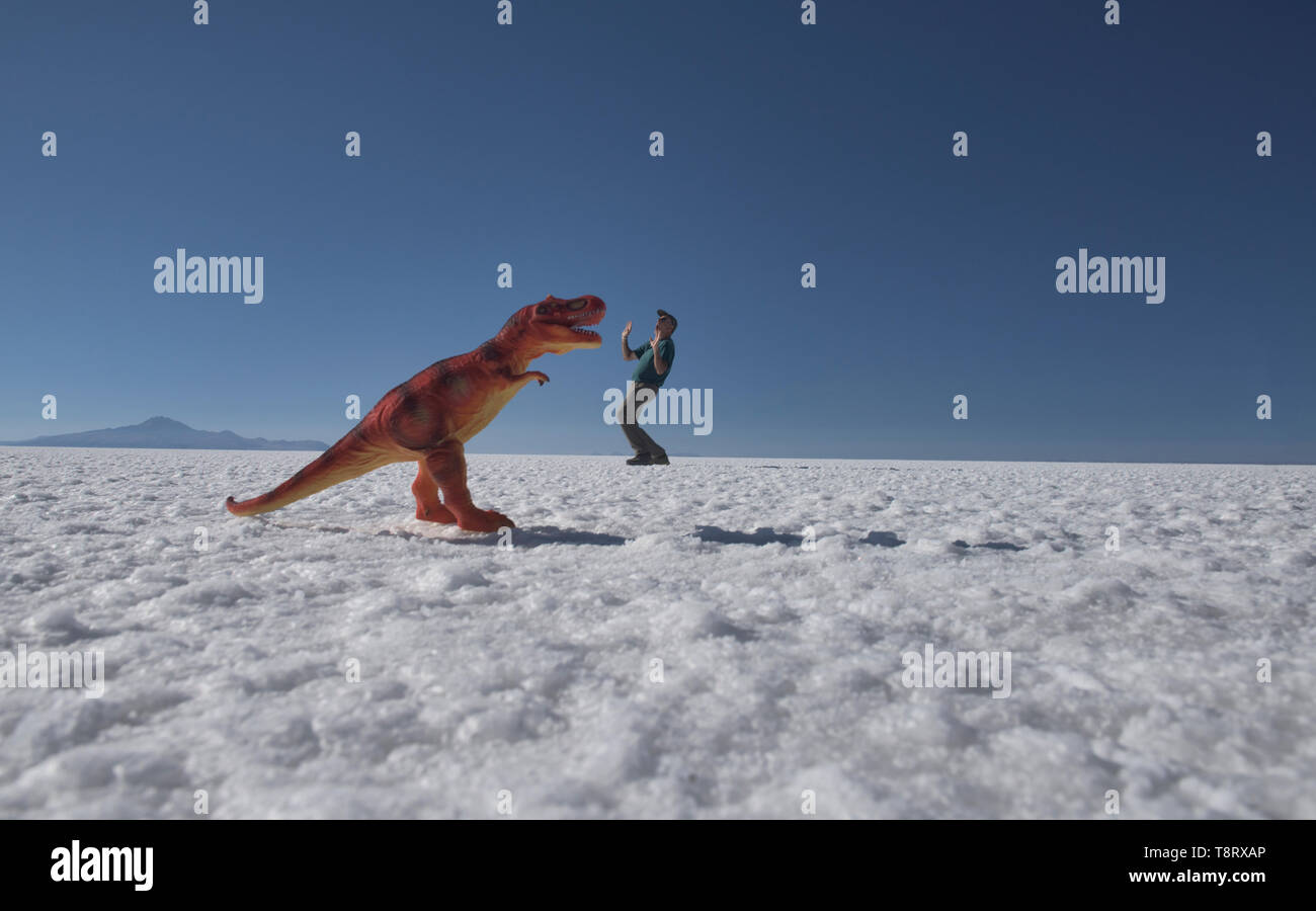 Running from the dinosaur on the vast salt flats of Salar de Uyuni ...