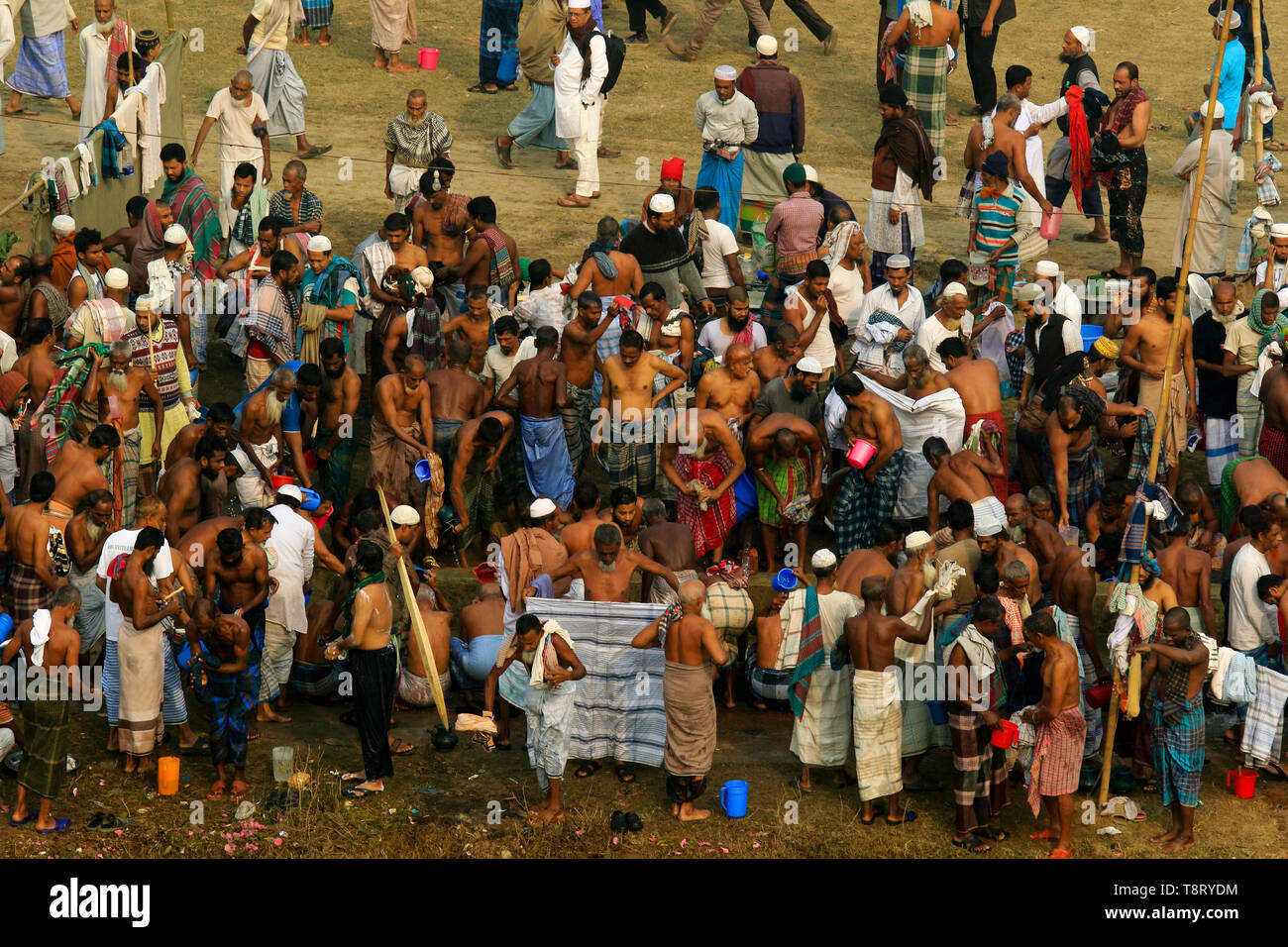 Devotees bathing at a corner of the Biswa Ijtema premises on the bank ...