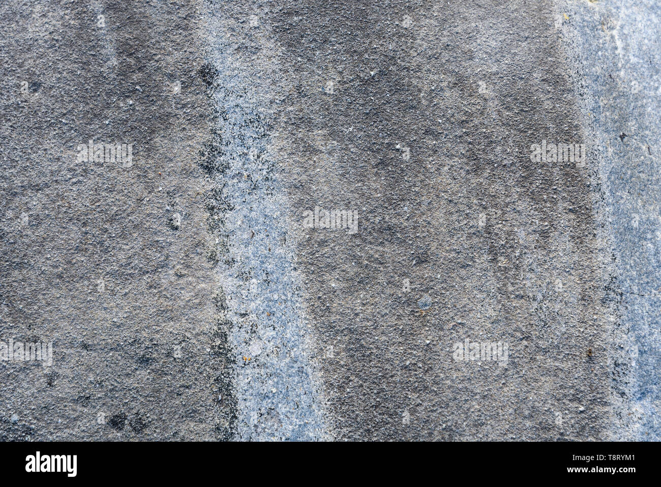 Rough texture in stone, gray with blue stripes, as a nature background ...