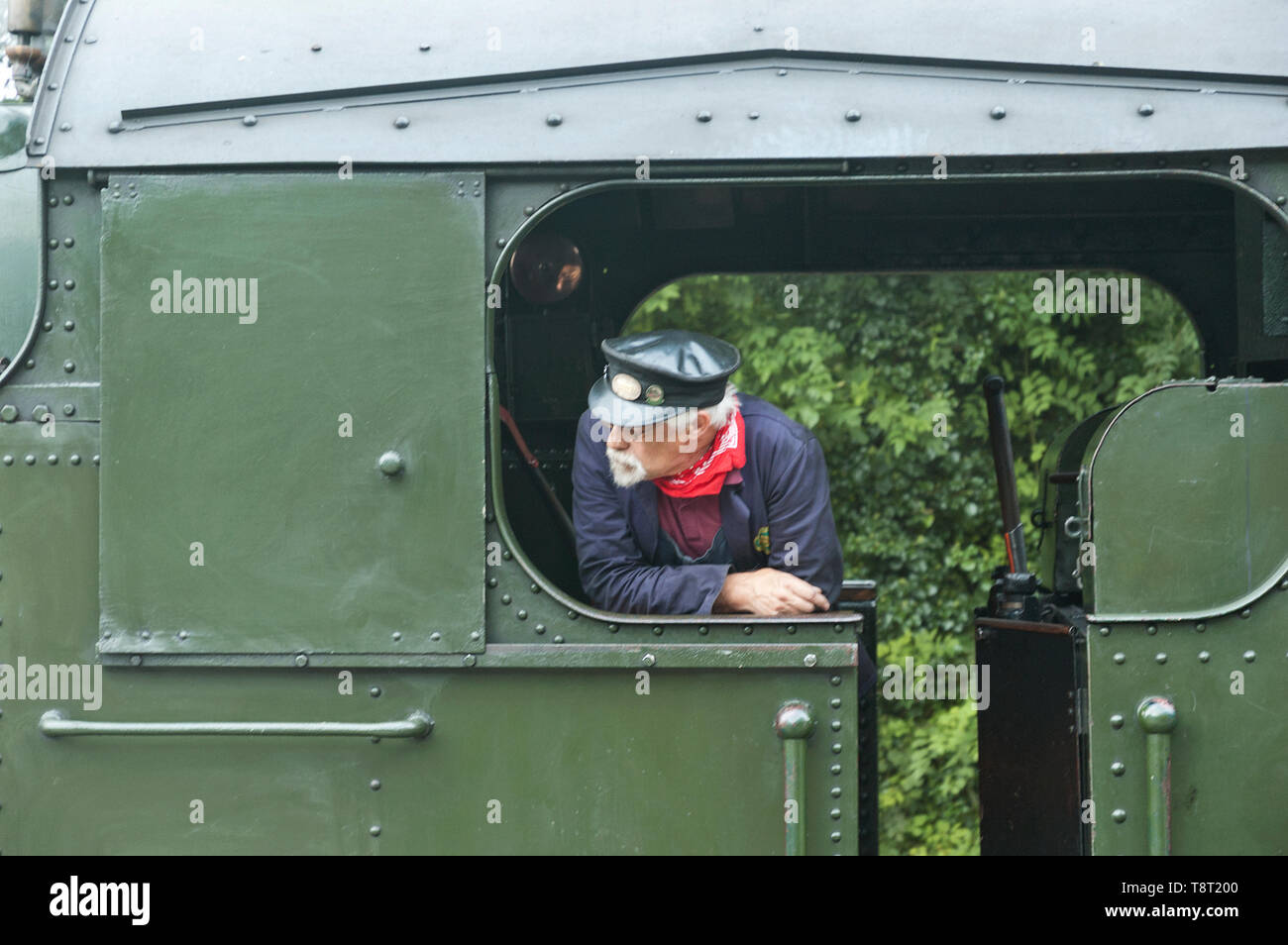 Driver in cab of GWR class 2-8-0T 4247 train at Bodmin Parkway Railway ...