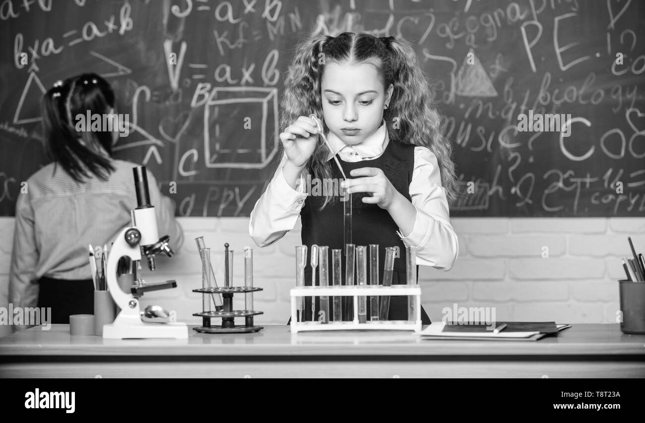 Concentrated on studying. Chemistry microscope. students doing biology ...