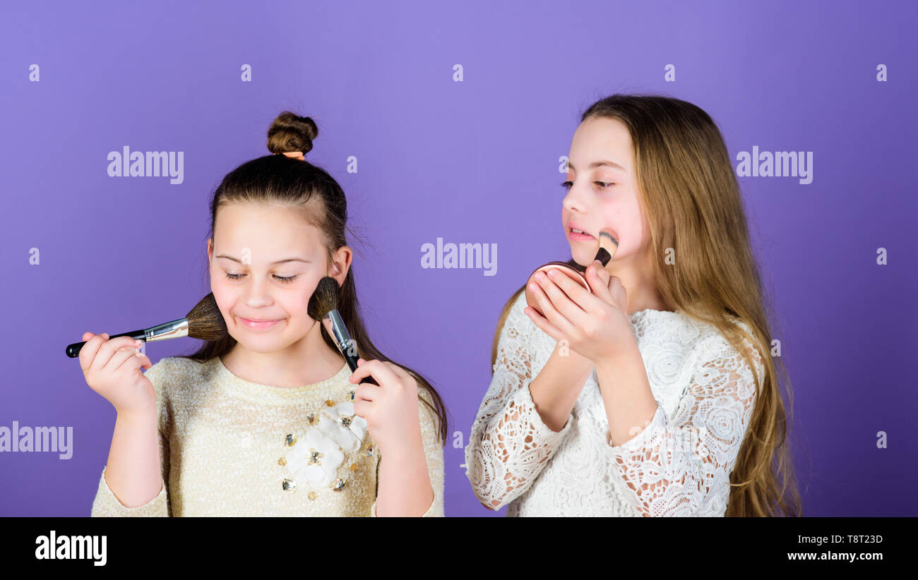 Making skin glow with makeup. Little makeup artists. Small girls ...