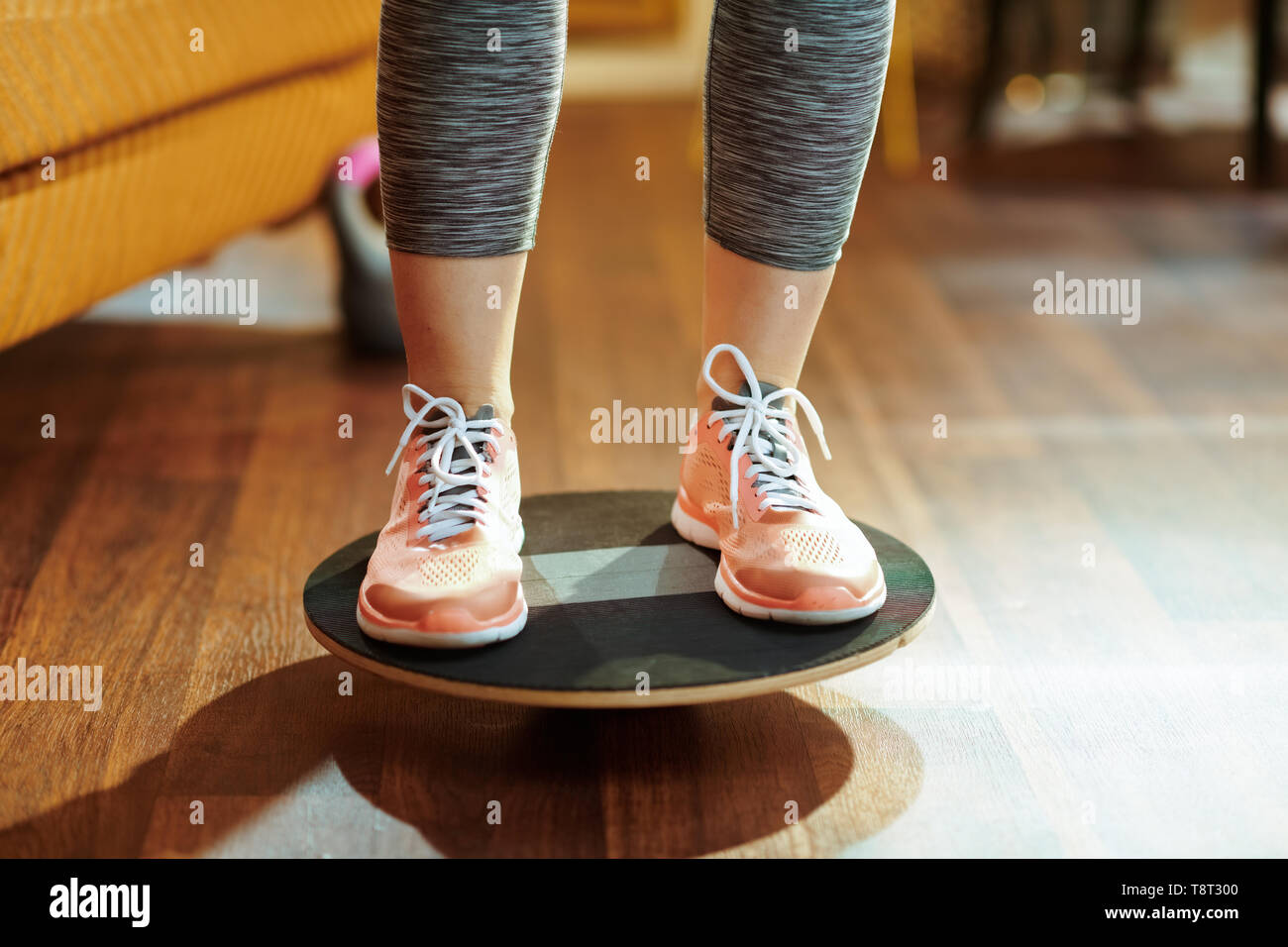 Closeup on fit sports woman in fitness clothes at modern home while ...