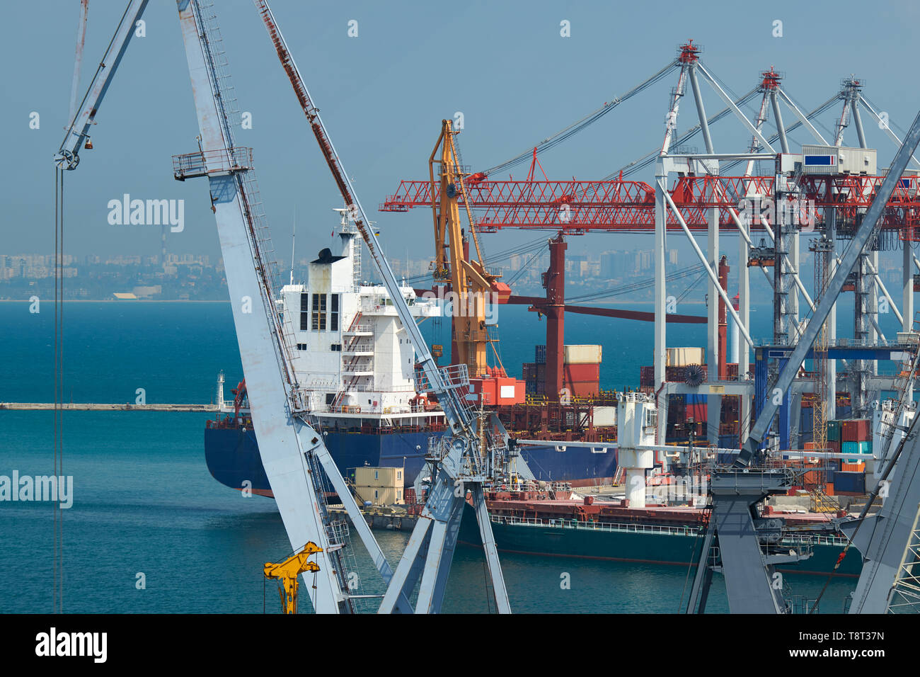 Industrial port, infrastructure of seaport, cranes and dry cargo ships ...