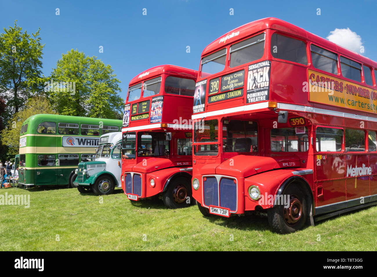 Variety of buses, including red double decker London buses, on display ...