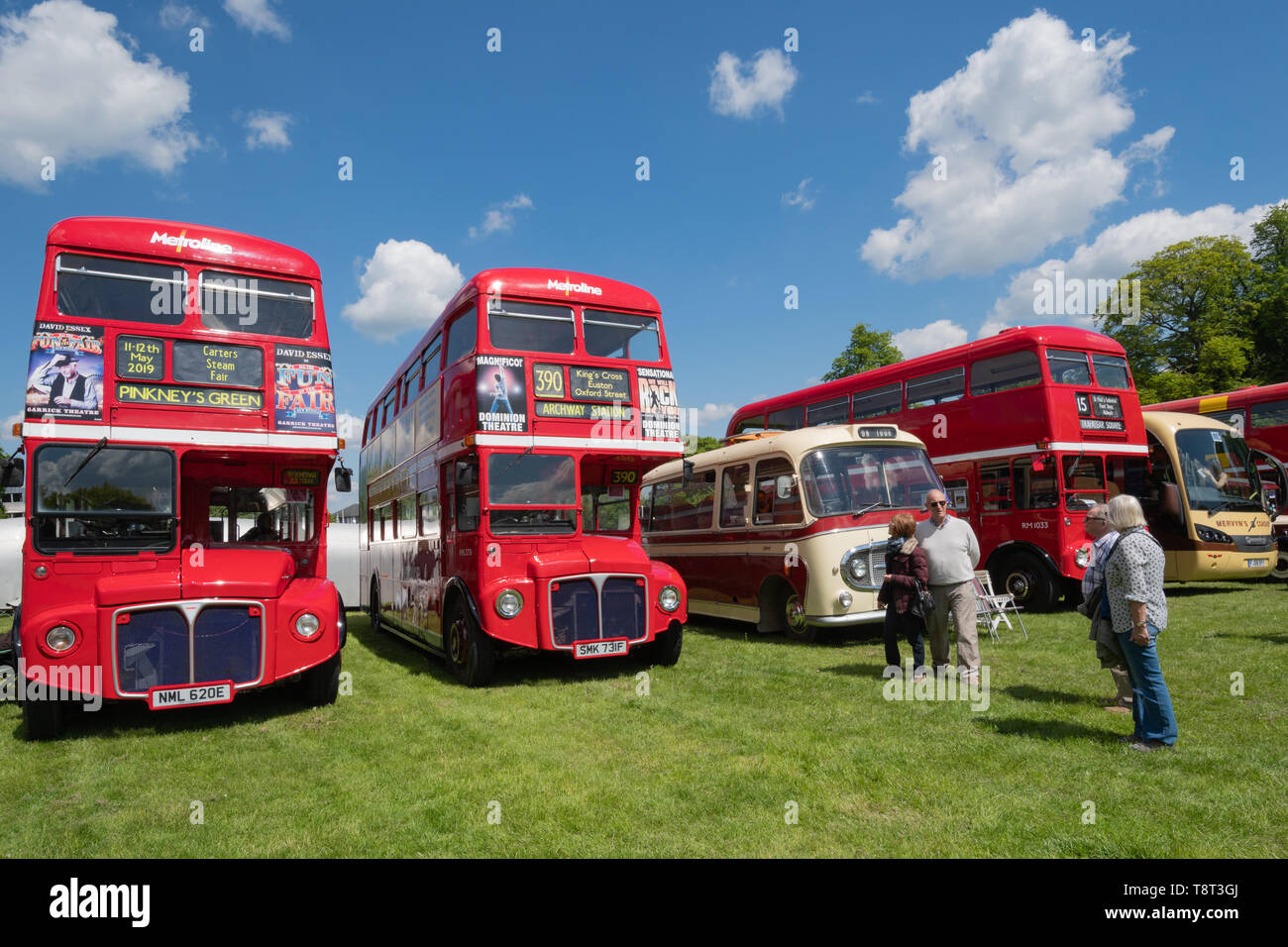 Variety of buses, including red double decker London buses, on display ...