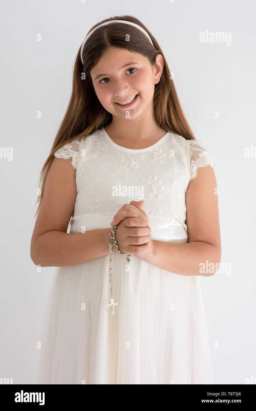 Girl in photo session for her first comunnion Stock Photo - Alamy