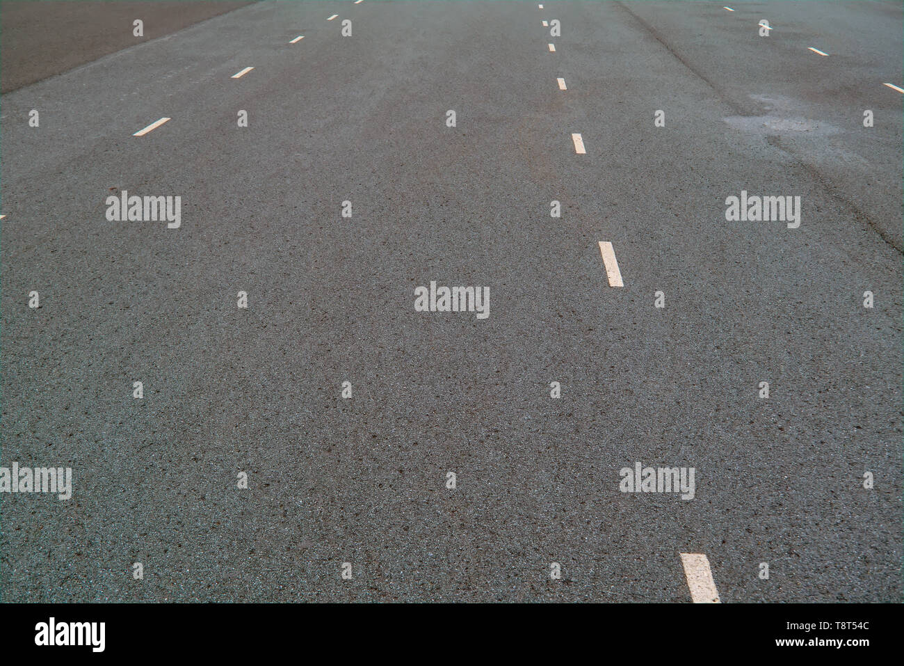 White dotted lines marking on asphalt natural background Stock Photo ...
