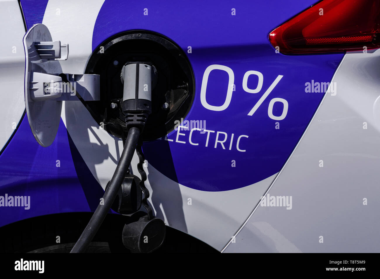 Electric white blue car charging battery, close view Stock Photo - Alamy