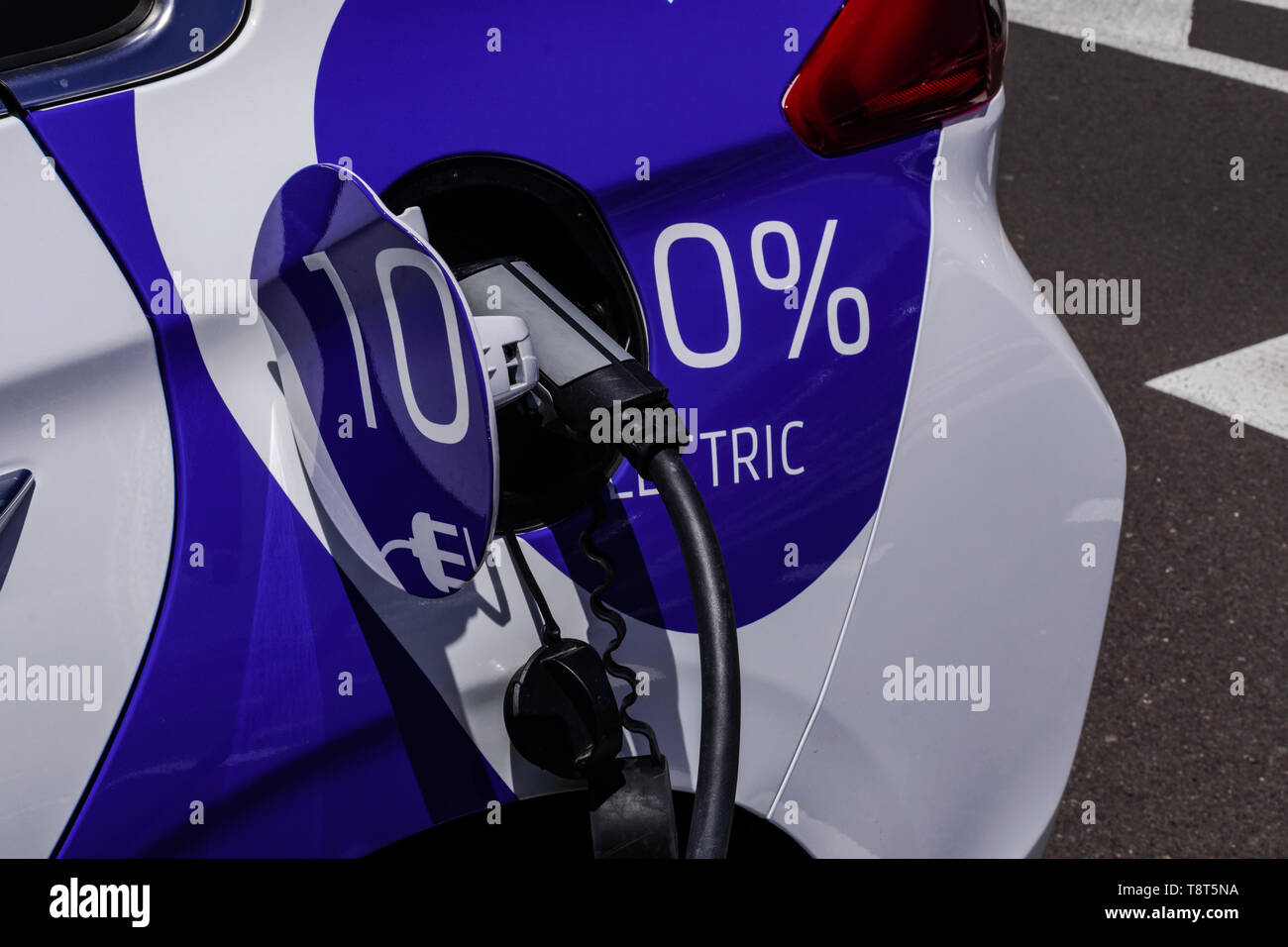 Electric white blue car charging battery, close view Stock Photo - Alamy