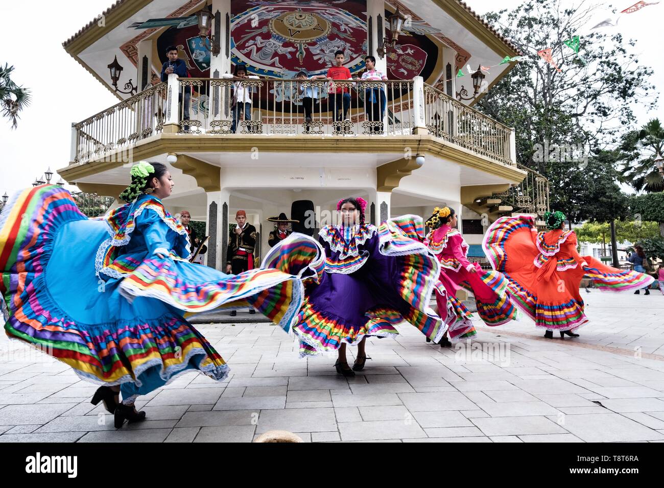 Costumed Mexican dancers perform the traditional Jarabe Tapatío folk dance in the Plaza Central ...