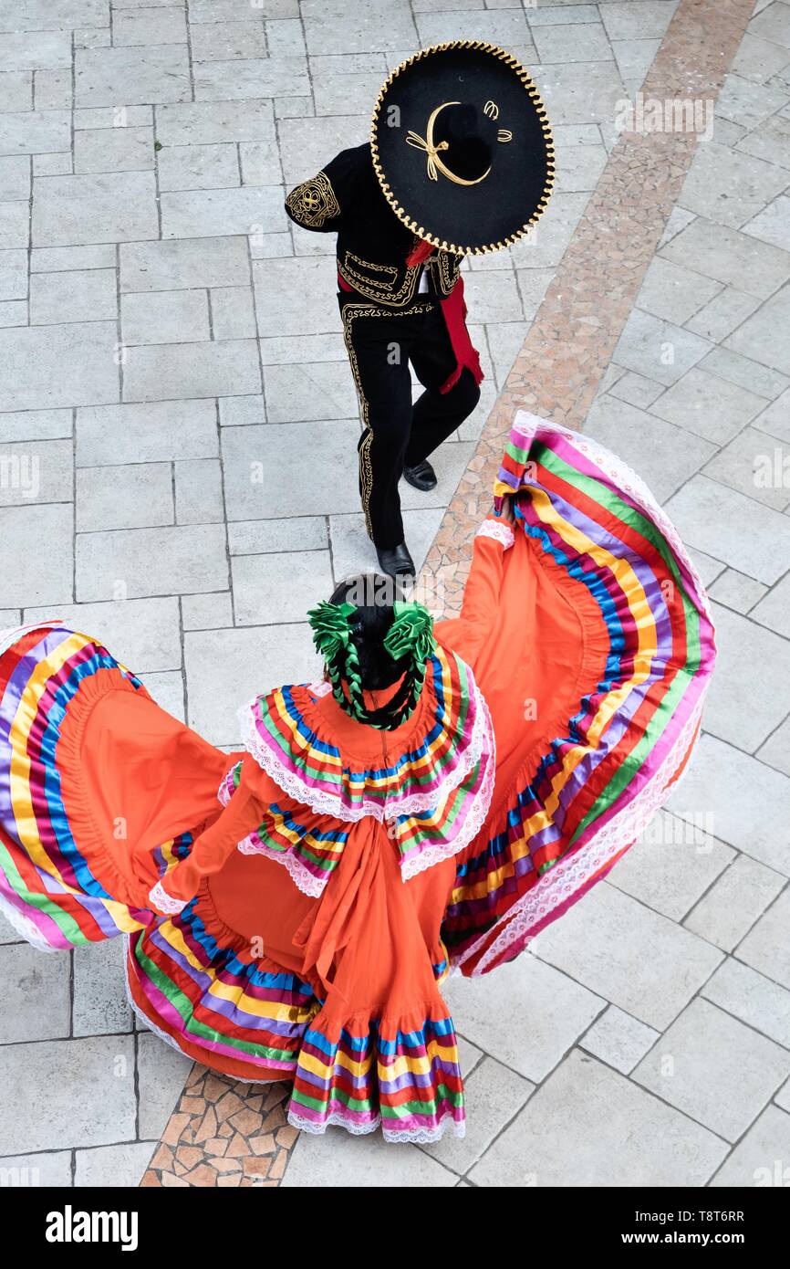 Costumed Mexican dancers perform the traditional Jarabe Tapatío folk dance in the Plaza Central ...