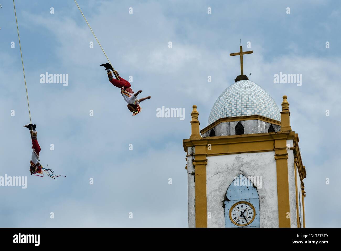 Voladores performs in front of the Church of the Assumption in Papantla ...