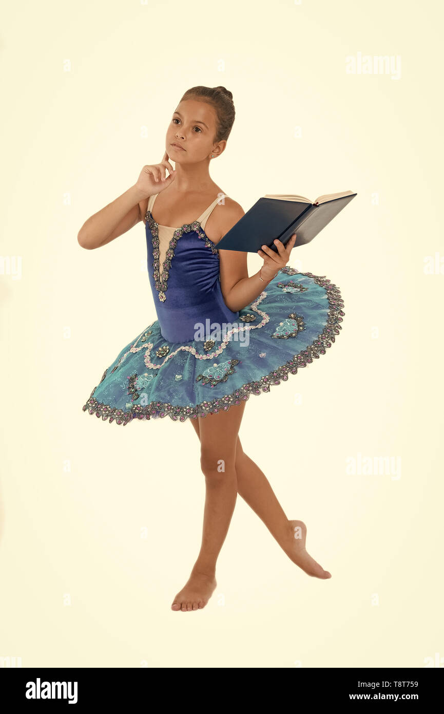 Girl ballerina dancing while read book. Ballet career issues. Depriving ...