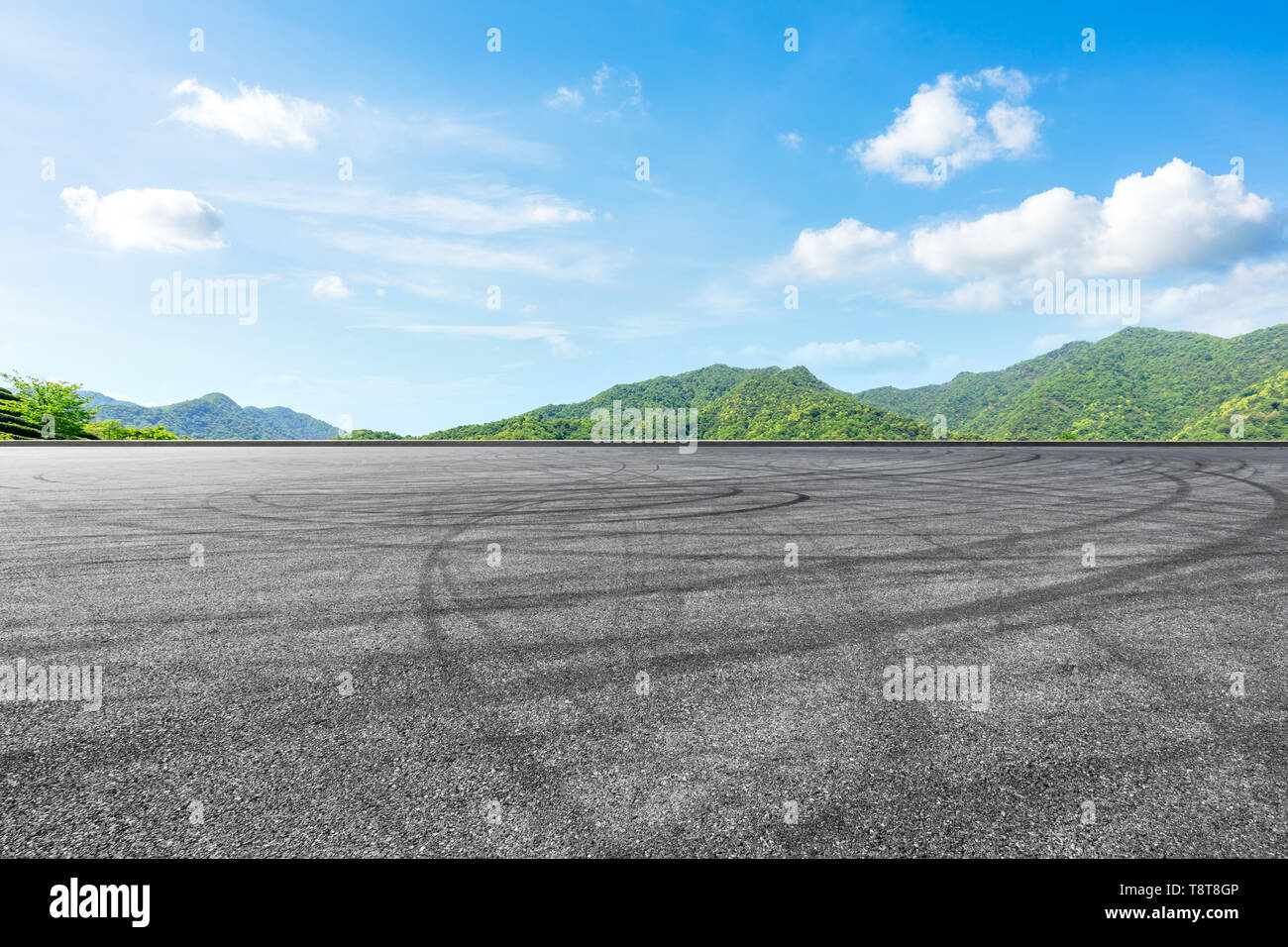 Asphalt race track ground and green mountains natural landscape Stock ...