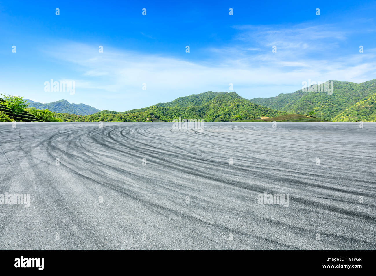 Asphalt race track ground and green mountains natural landscape Stock ...