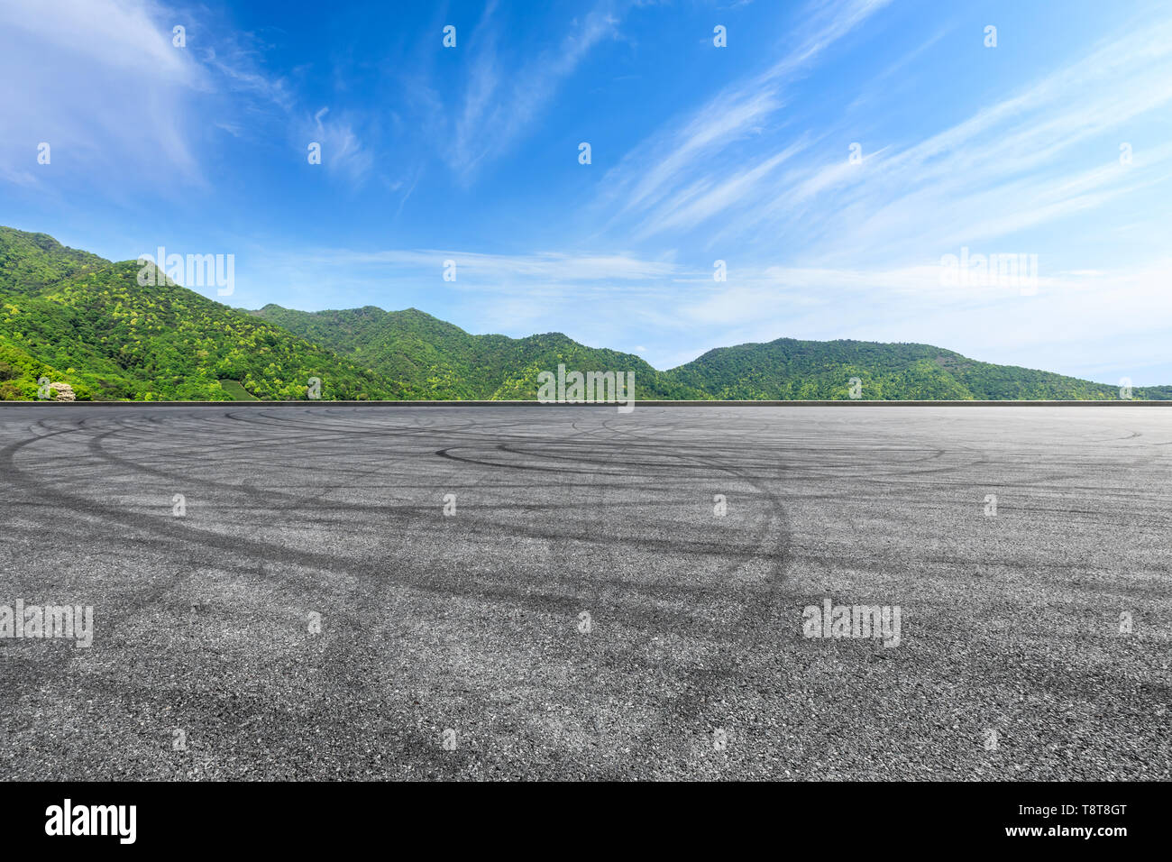 Asphalt race track ground and green mountains natural landscape Stock ...