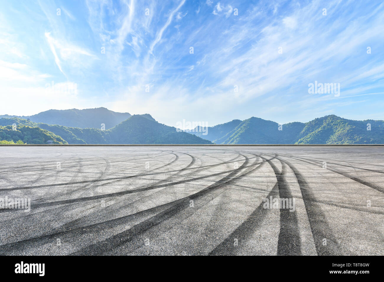 Asphalt race track ground and green mountains natural landscape Stock ...